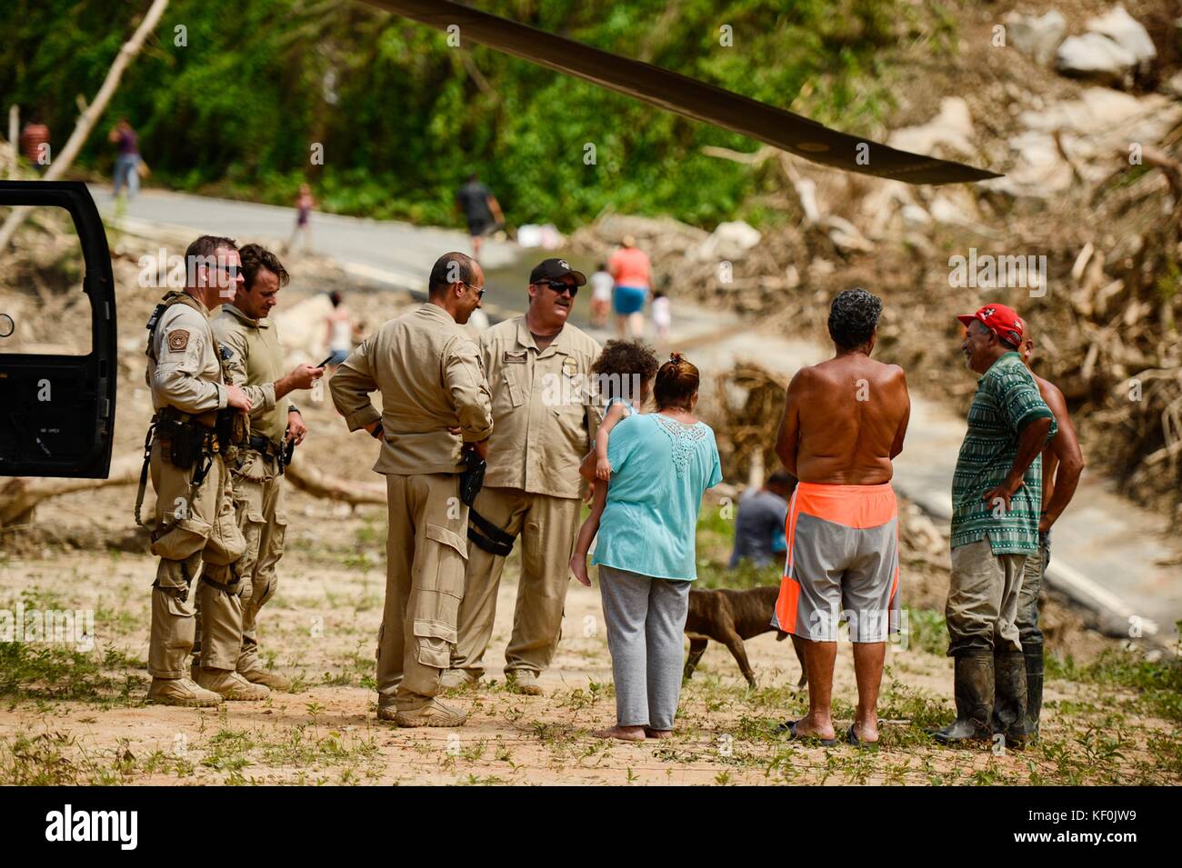 U.S. Customs and Border Protection officers deliver water and emergency ...