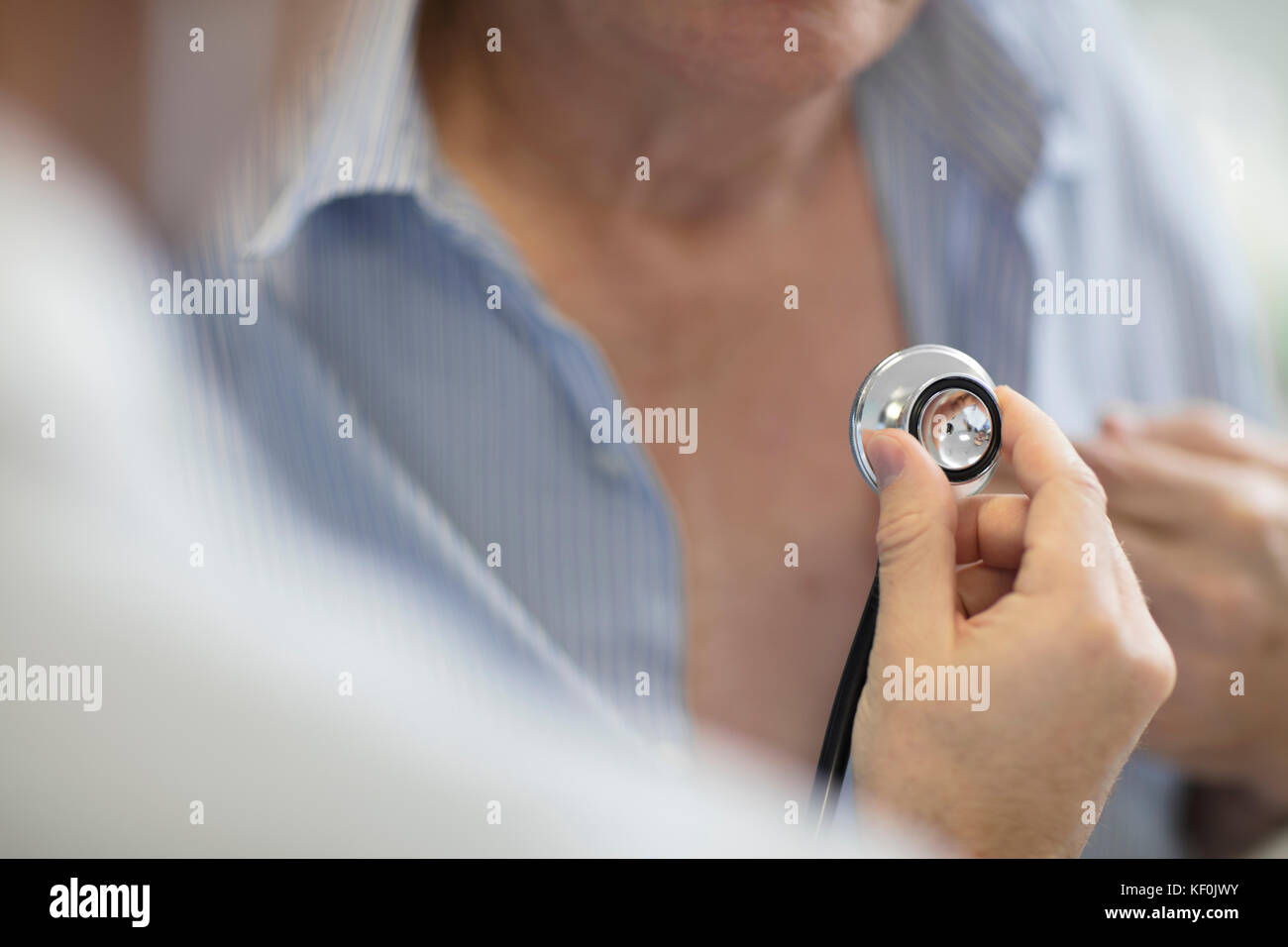 Close-up of doctor examiming senior patient Stock Photo - Alamy