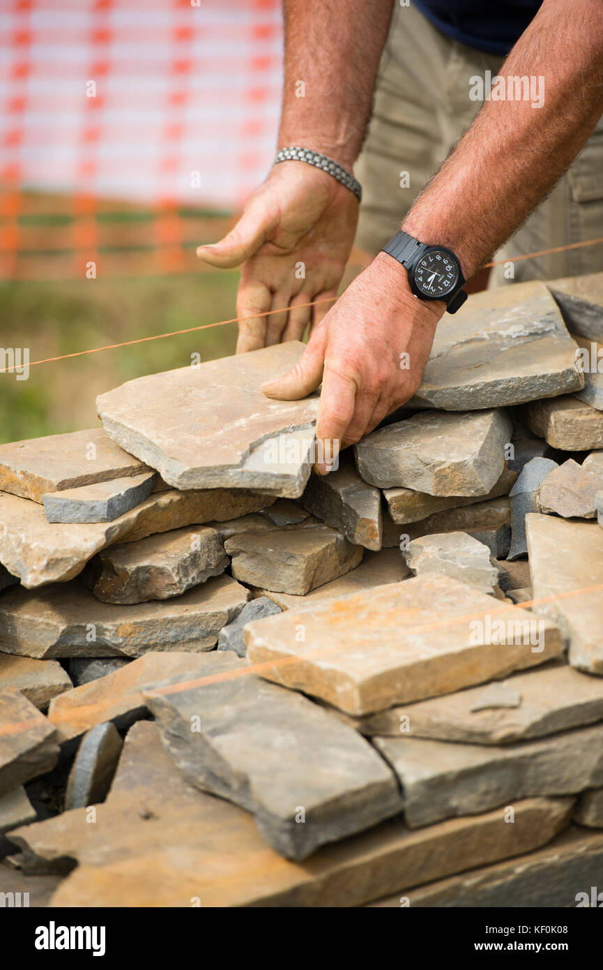 A man demonstrating dry-stone wall techniques at the Royal Welsh ...