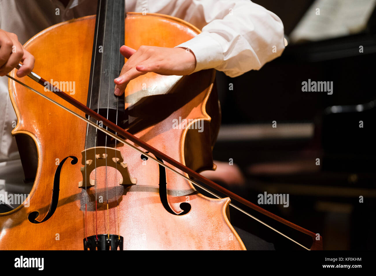 Music Education : A young musician playing in a cello workshop class ...