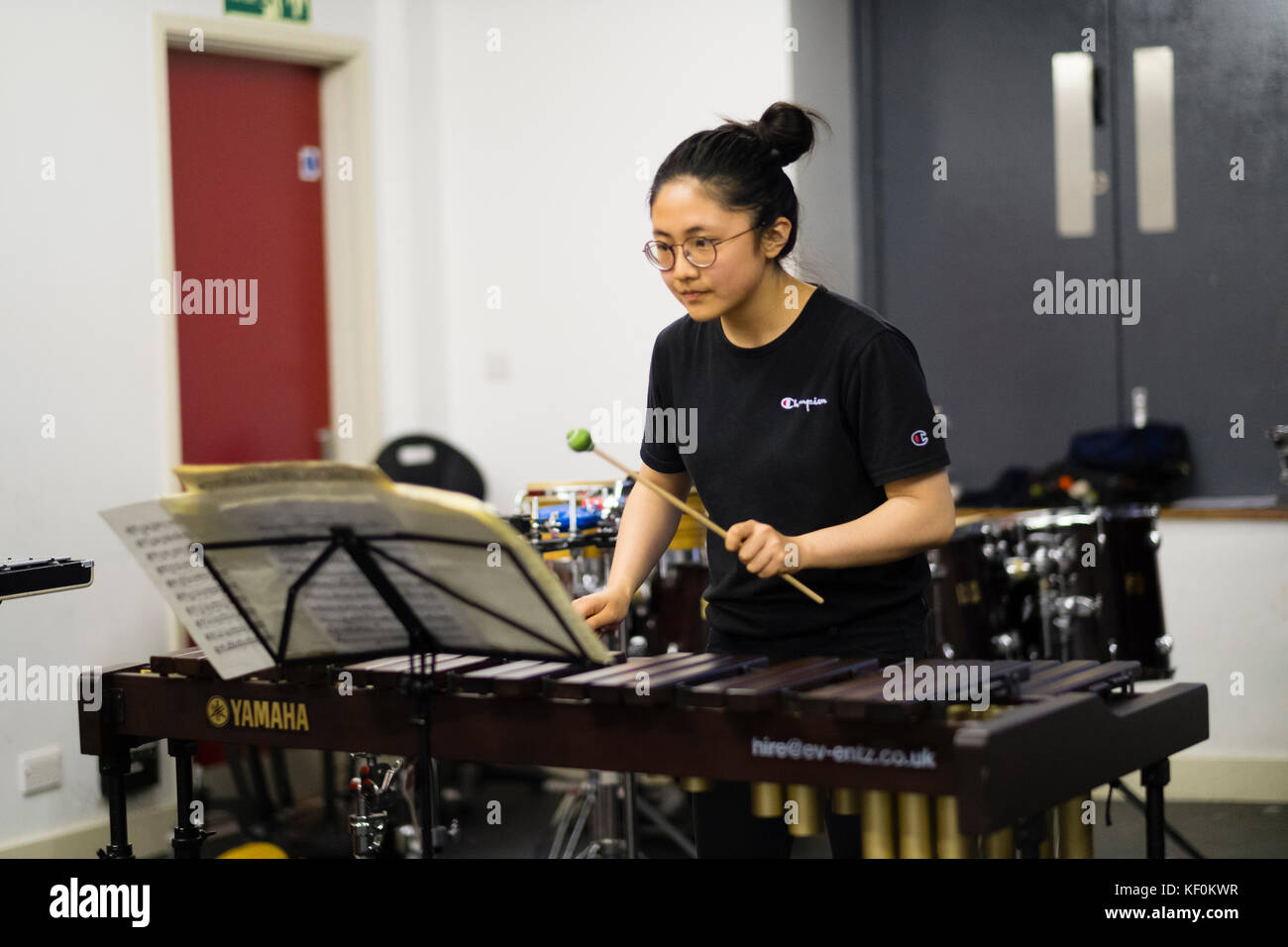 A young woman playing the Xylophone in a Percussion Showcase at ...
