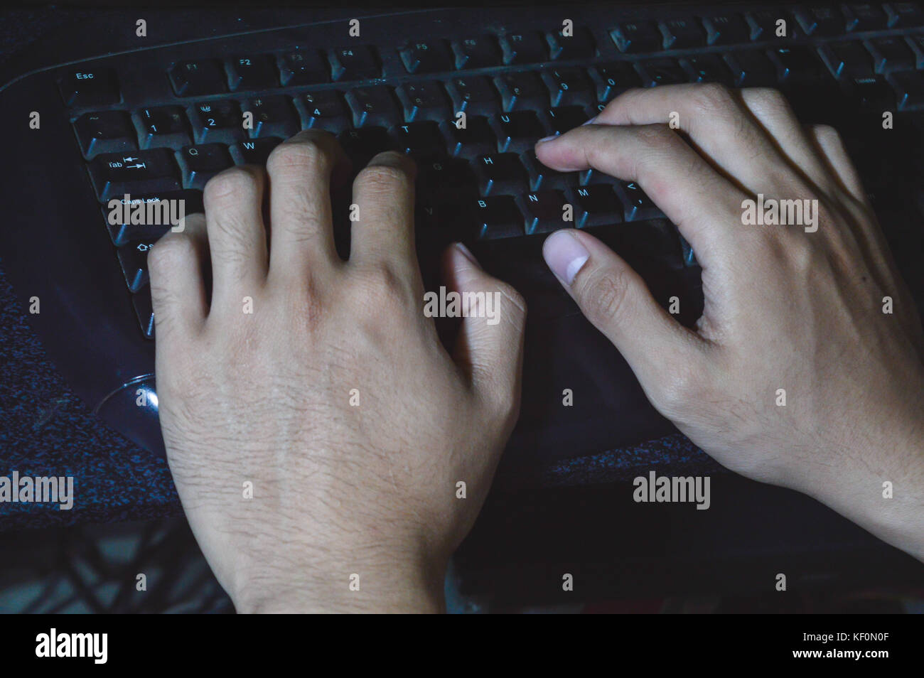 human finger is typing on a keyboard Stock Photo - Alamy