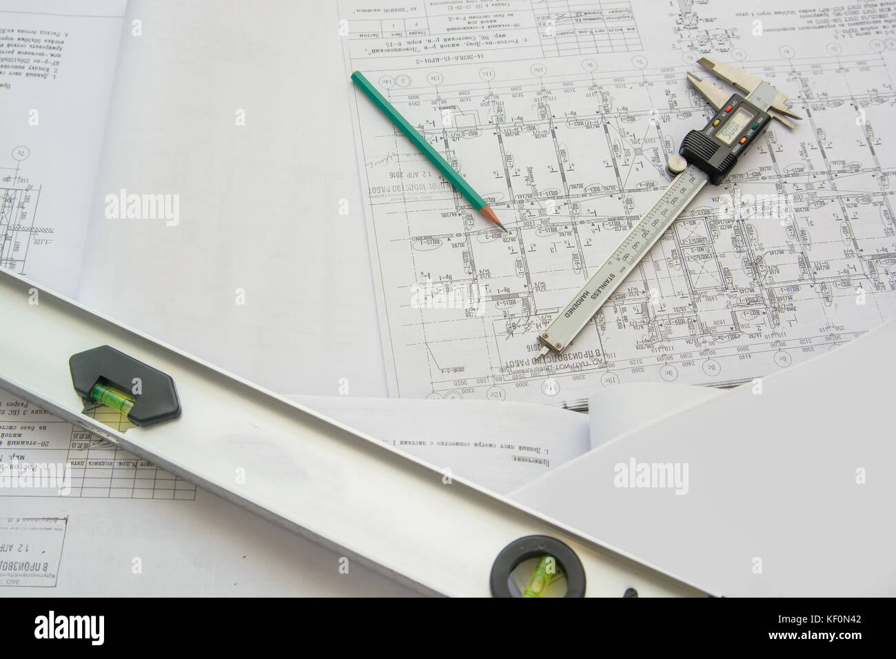 Closeup of man's hands holding blueprints at construction site Stock ...