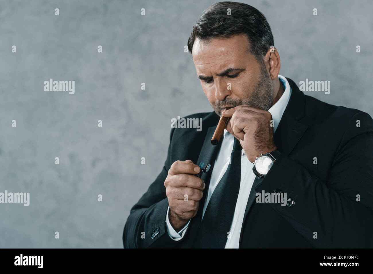 businessman smoking cigar Stock Photo - Alamy