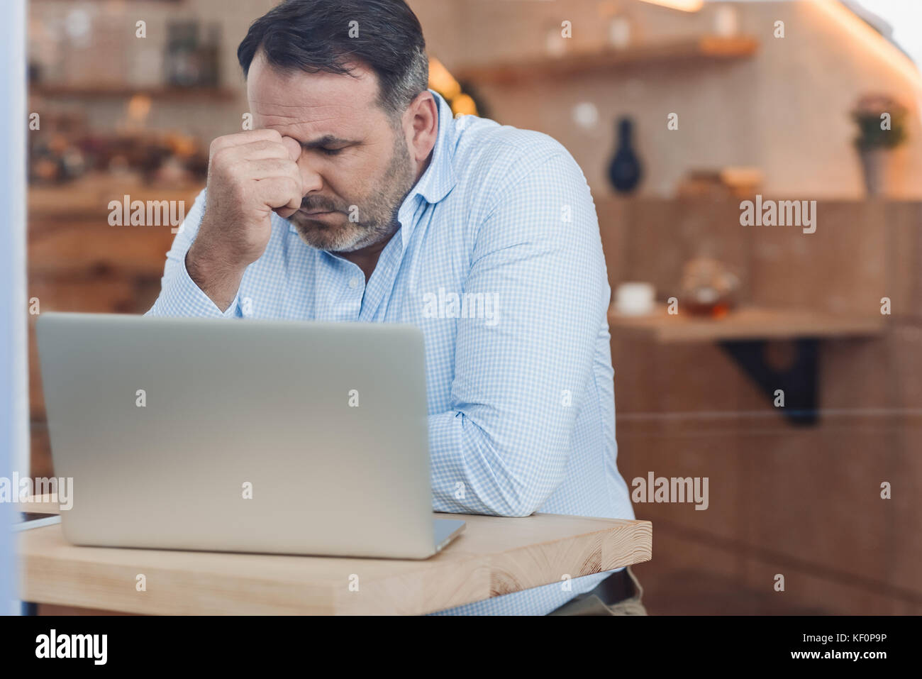 depressed businessman with laptop Stock Photo - Alamy