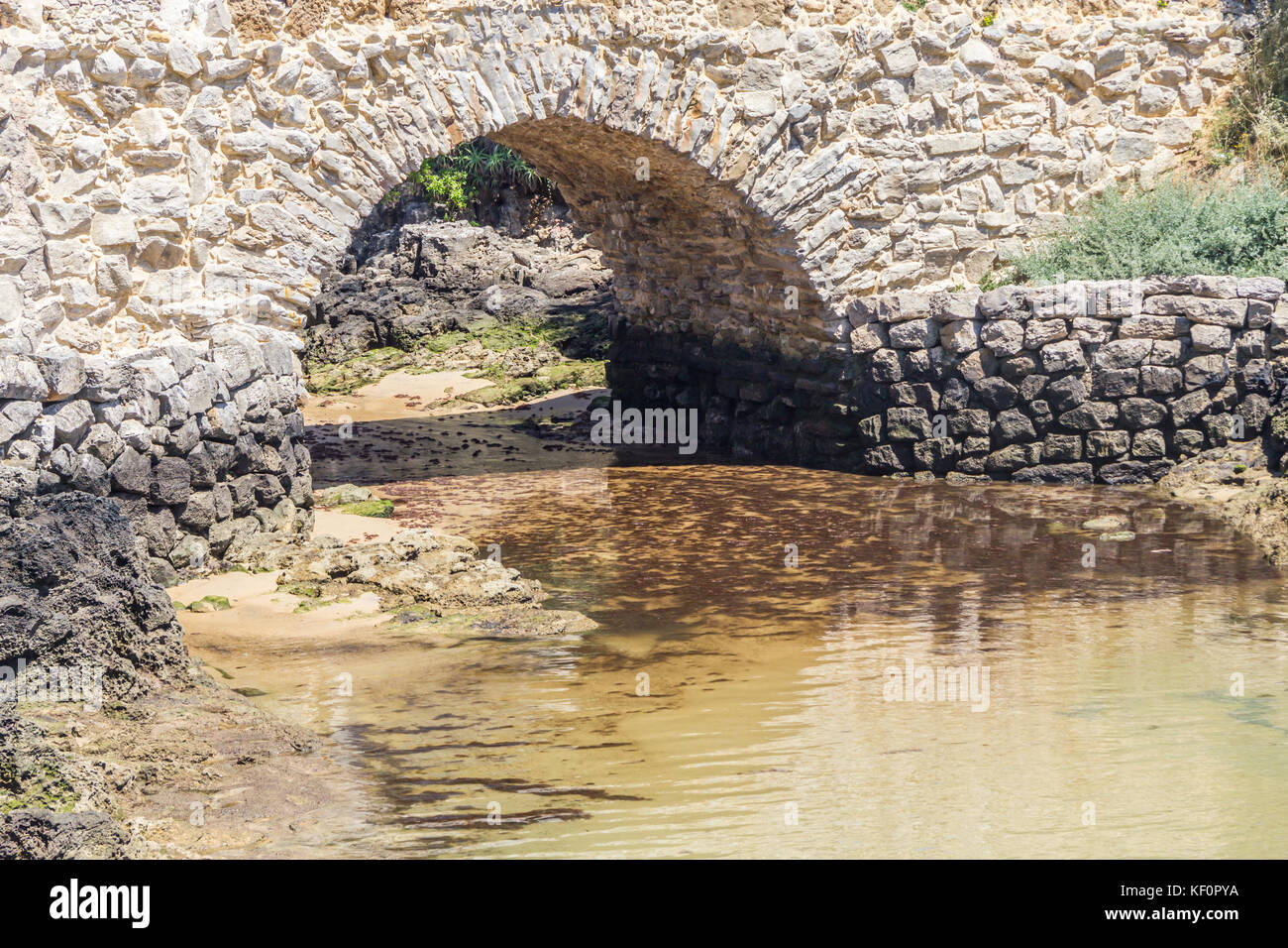 Historic rock bridge in Cascais, Portugal Stock Photo - Alamy