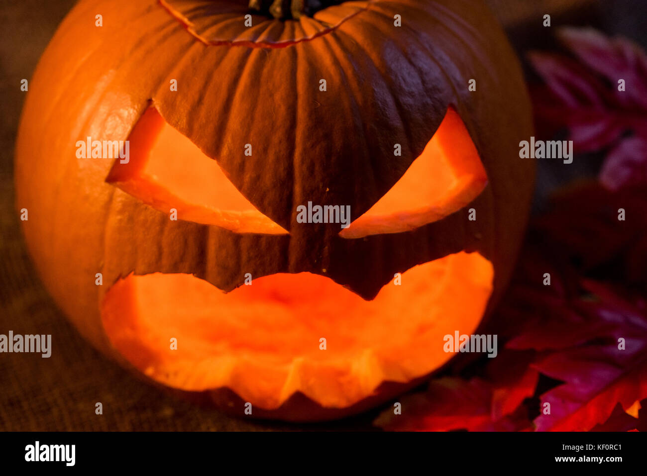 Scary jack-o-lantern with light inside close up Stock Photo - Alamy