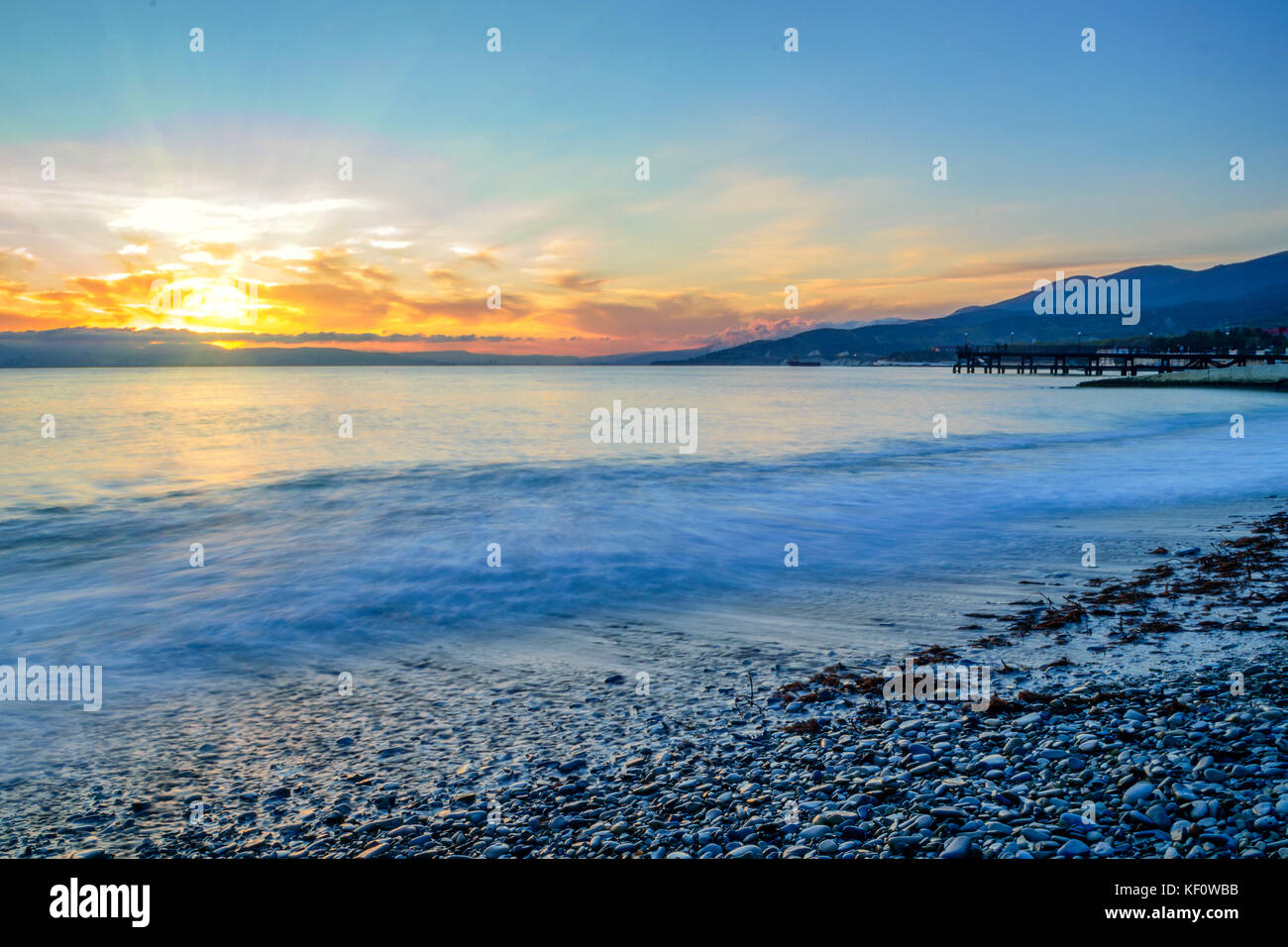 Beautiful natural sunset over sea Stock Photo - Alamy