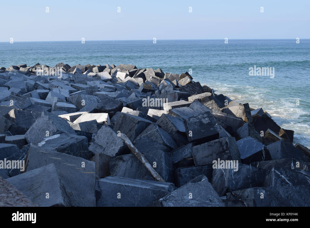 Big stone blocks on the ocean front, protecting the shore of San ...