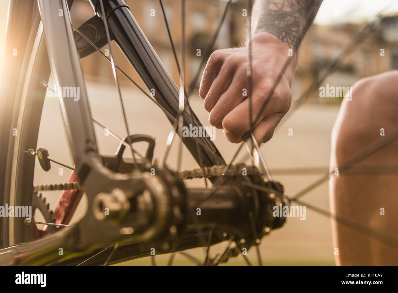 man repairing bicycle Stock Photo - Alamy