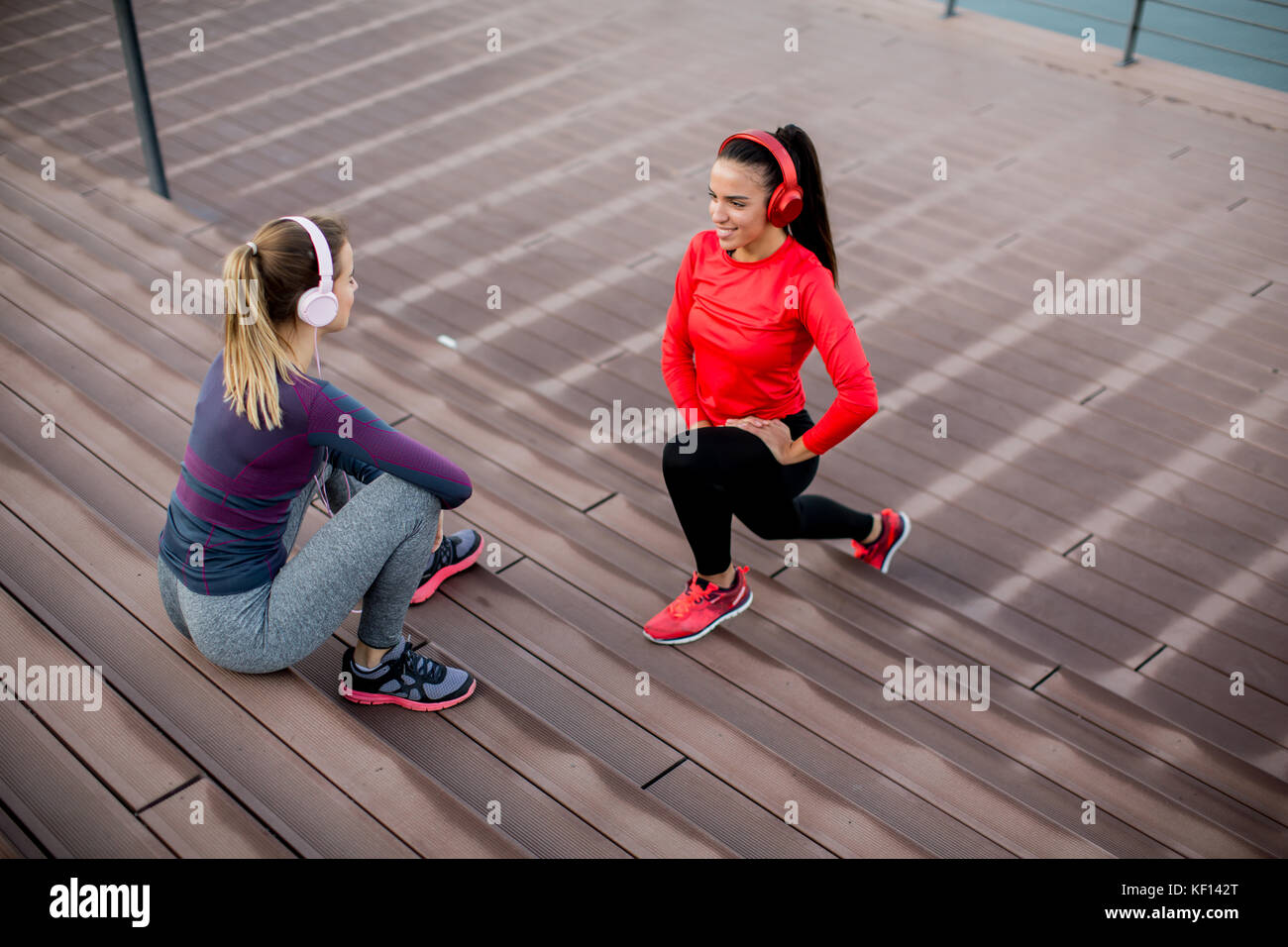 View at two young women exercise outside Stock Photo - Alamy