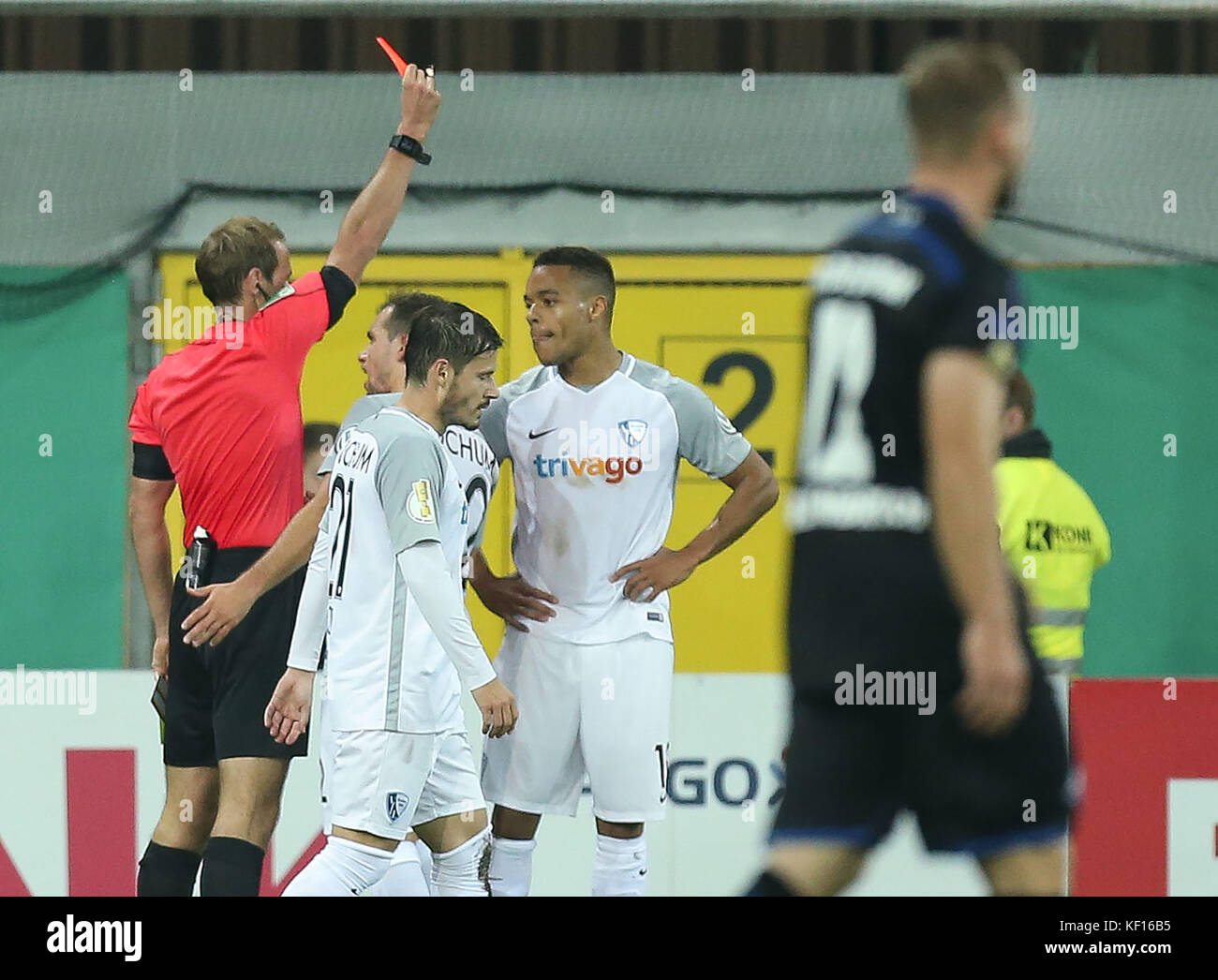 Bochum's Jan Gyamerah (R) receving a yellow-red card from match referee ...