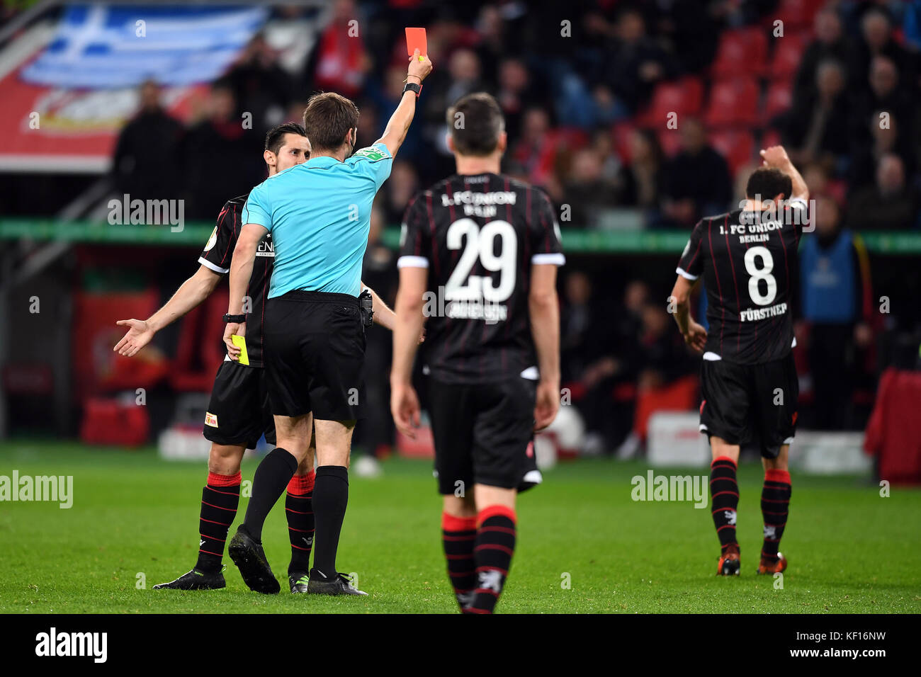 Match referee Frank Willenborg showing the yellow-red card to Berlin's ...