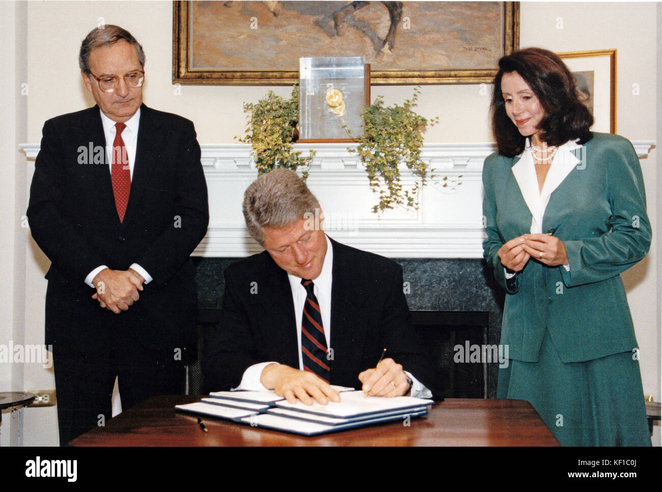 United States President Bill Clinton signs an executive order renewing ...
