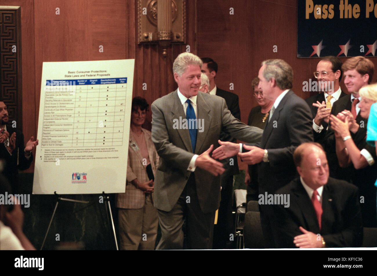United States President Bill Clinton shakes hands with US Senator Tom ...