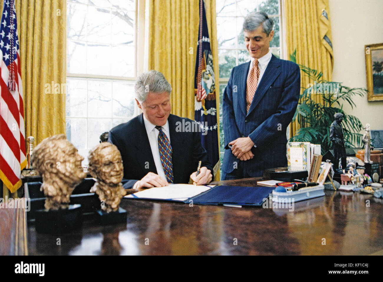 United States President Bill Clinton signs the Debt Limit Extension ...