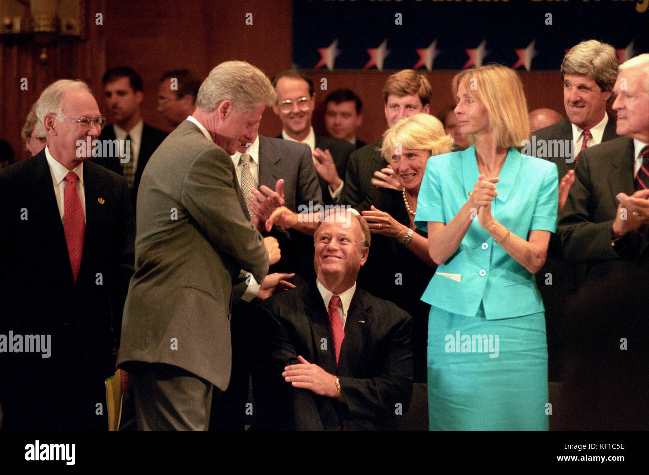 United States President Bill Clinton shakes hands with US Senator Max ...