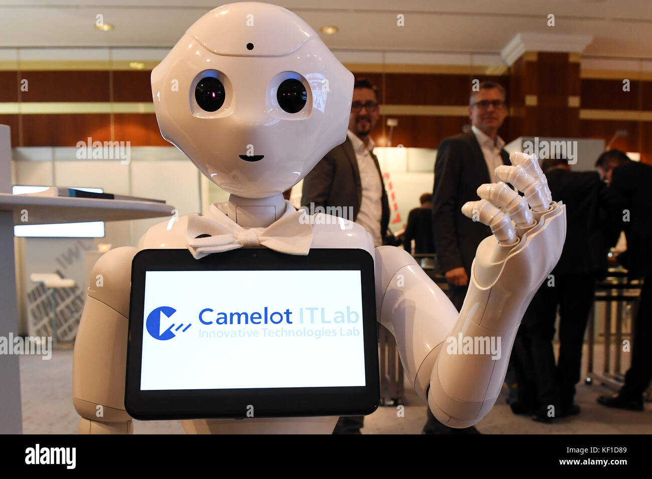 Berlin, Germany. 25th Oct, 2017. A robot greets the visitors of the ...