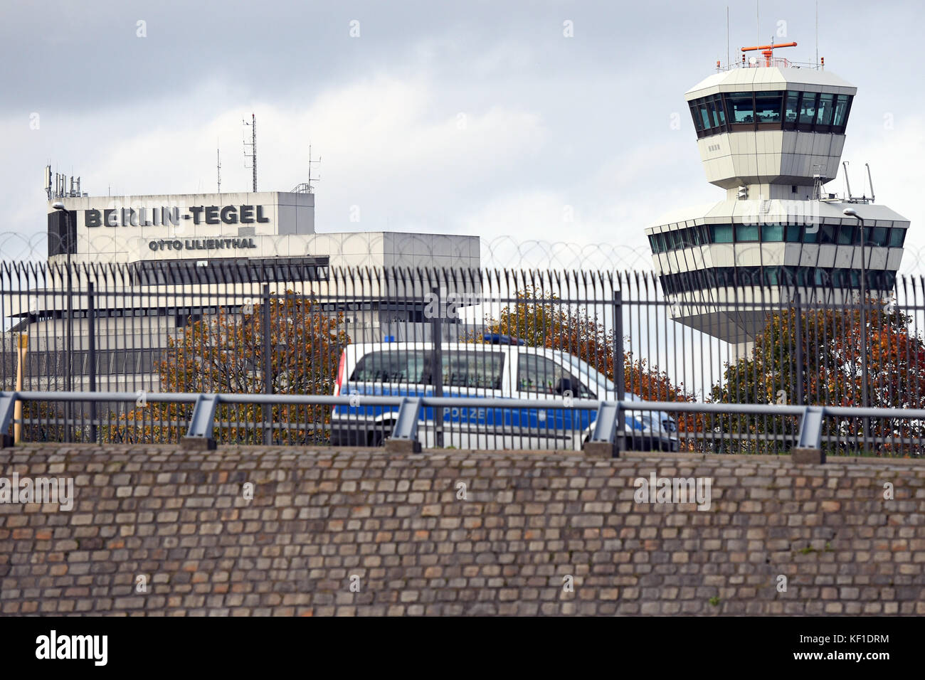 A police car drives by the check-in building of Tegel Airport in Berlin ...