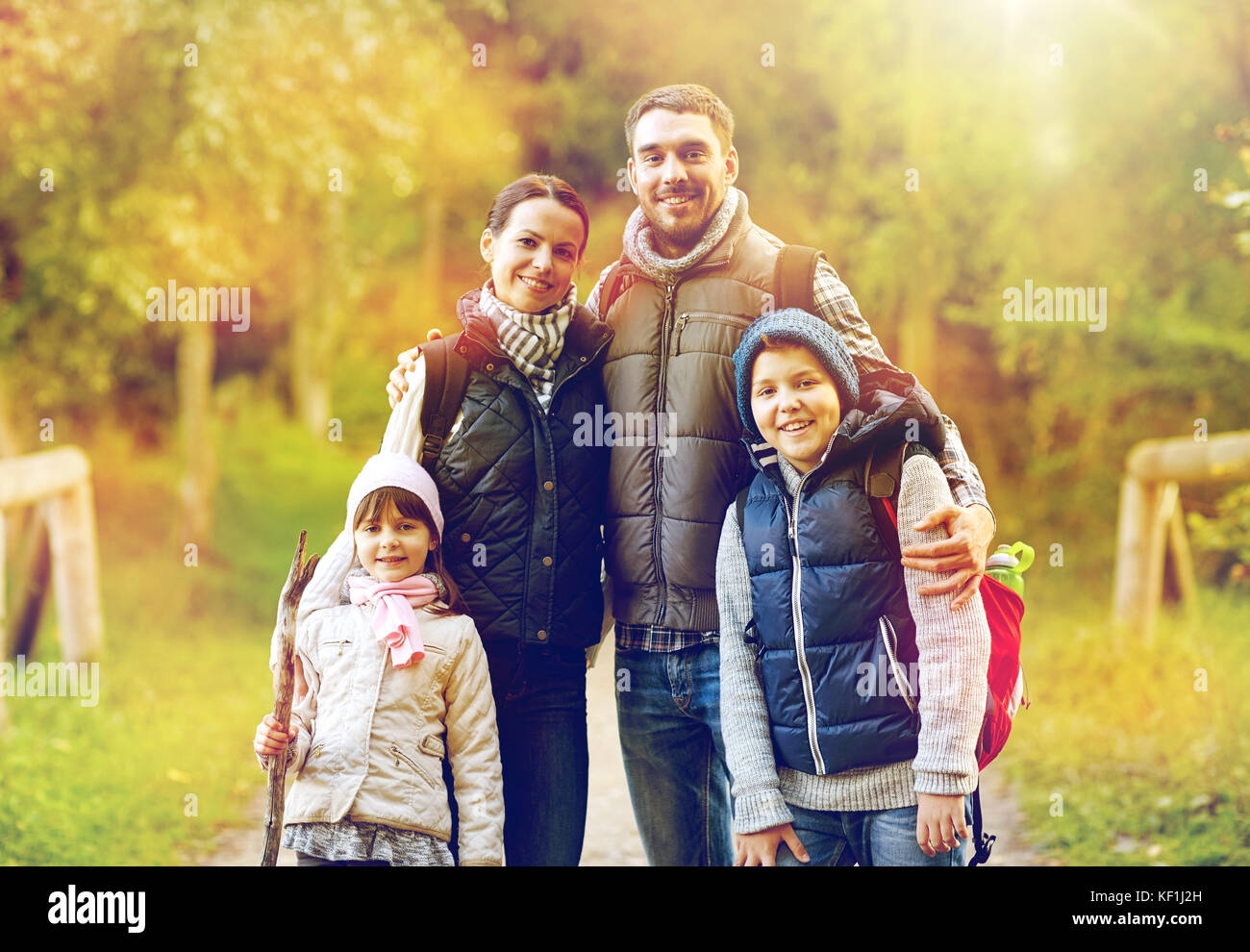 happy family with backpacks hiking Stock Photo - Alamy