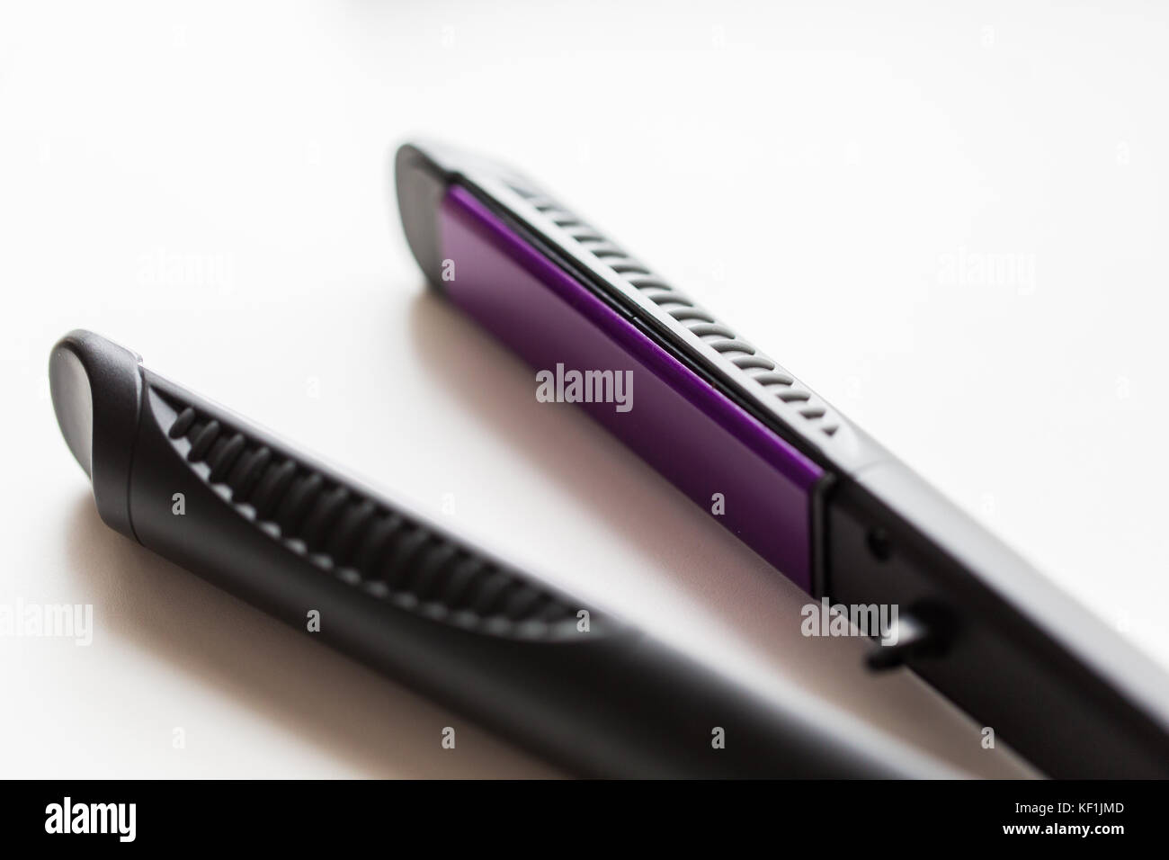 Professional hair iron straightening hi-res stock photography and ...