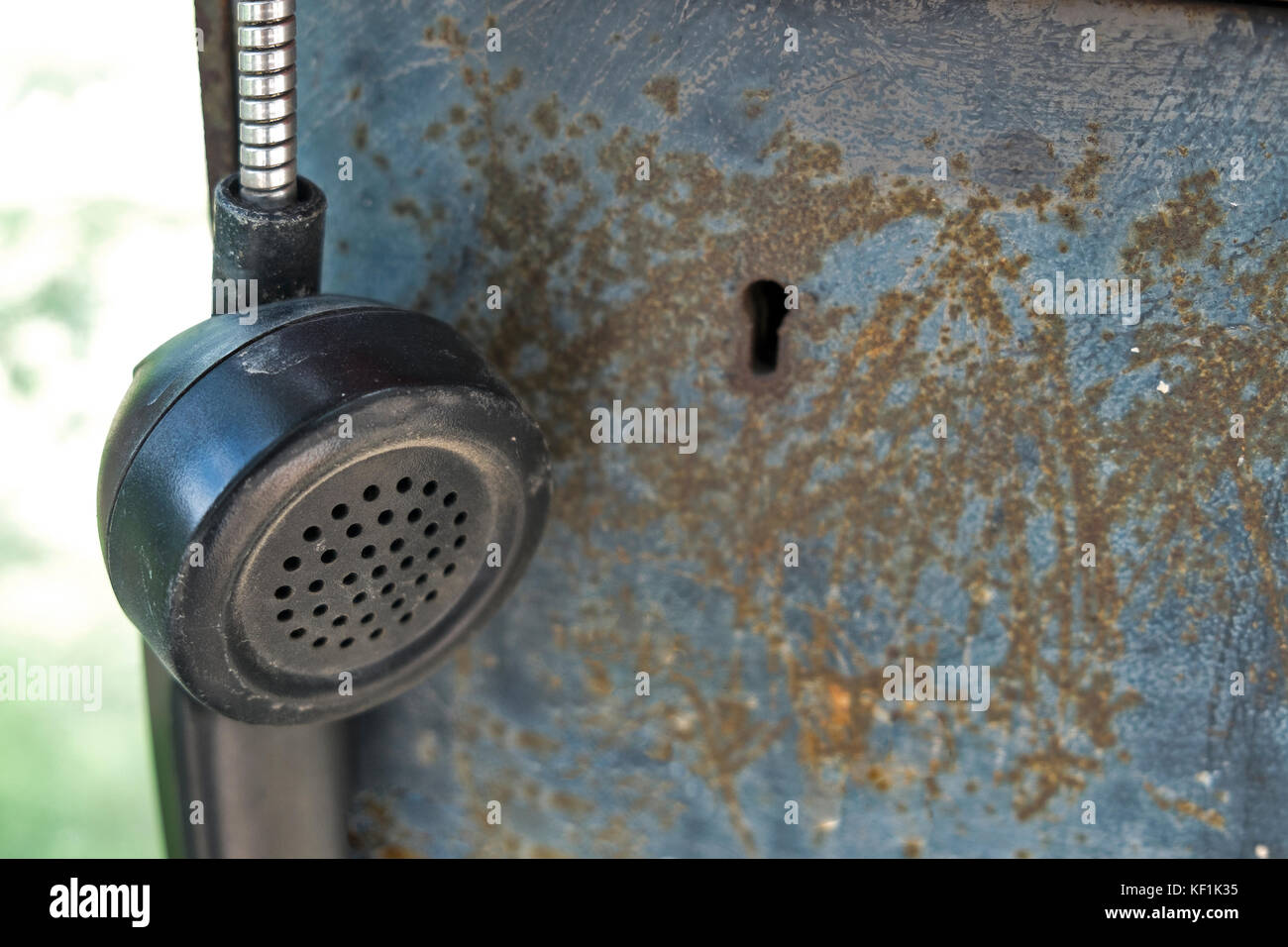 Hanging old phone receiver with grunge background Stock Photo - Alamy