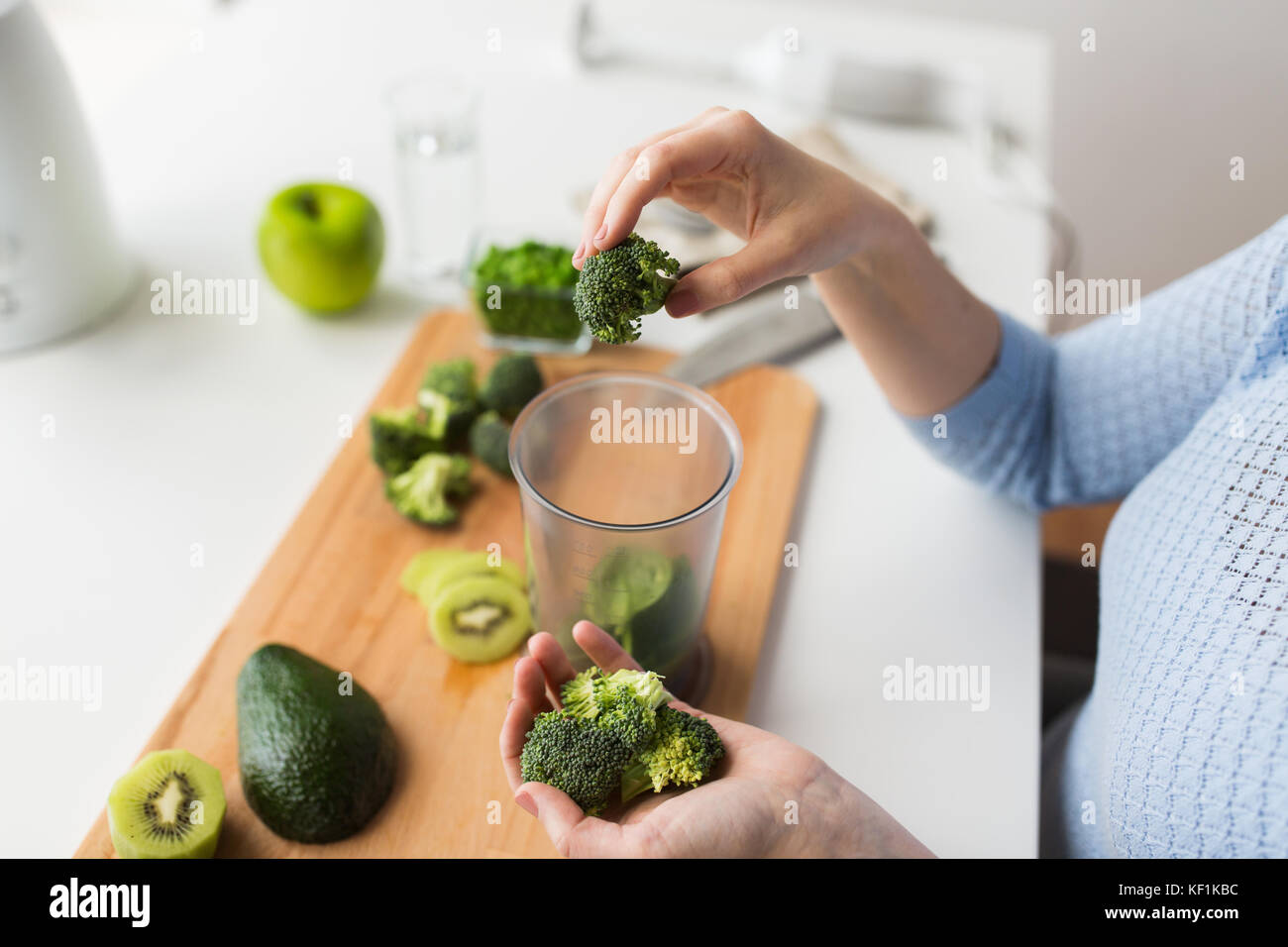 Female hand adding raw hi-res stock photography and images - Alamy