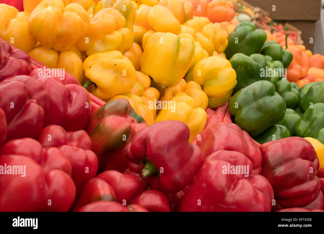 Table full of ripe colorful bell peppers at Farmers Market Stock Photo ...