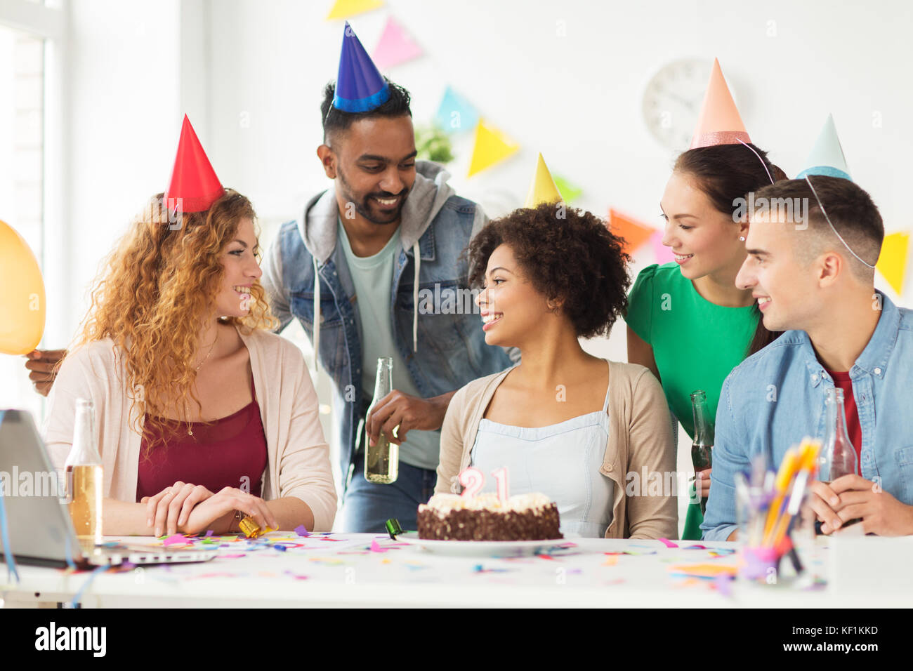 team greeting colleague at office birthday party Stock Photo - Alamy