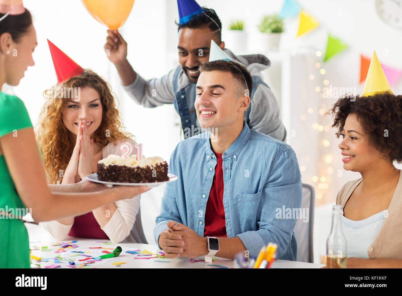 team greeting colleague at office birthday party Stock Photo - Alamy