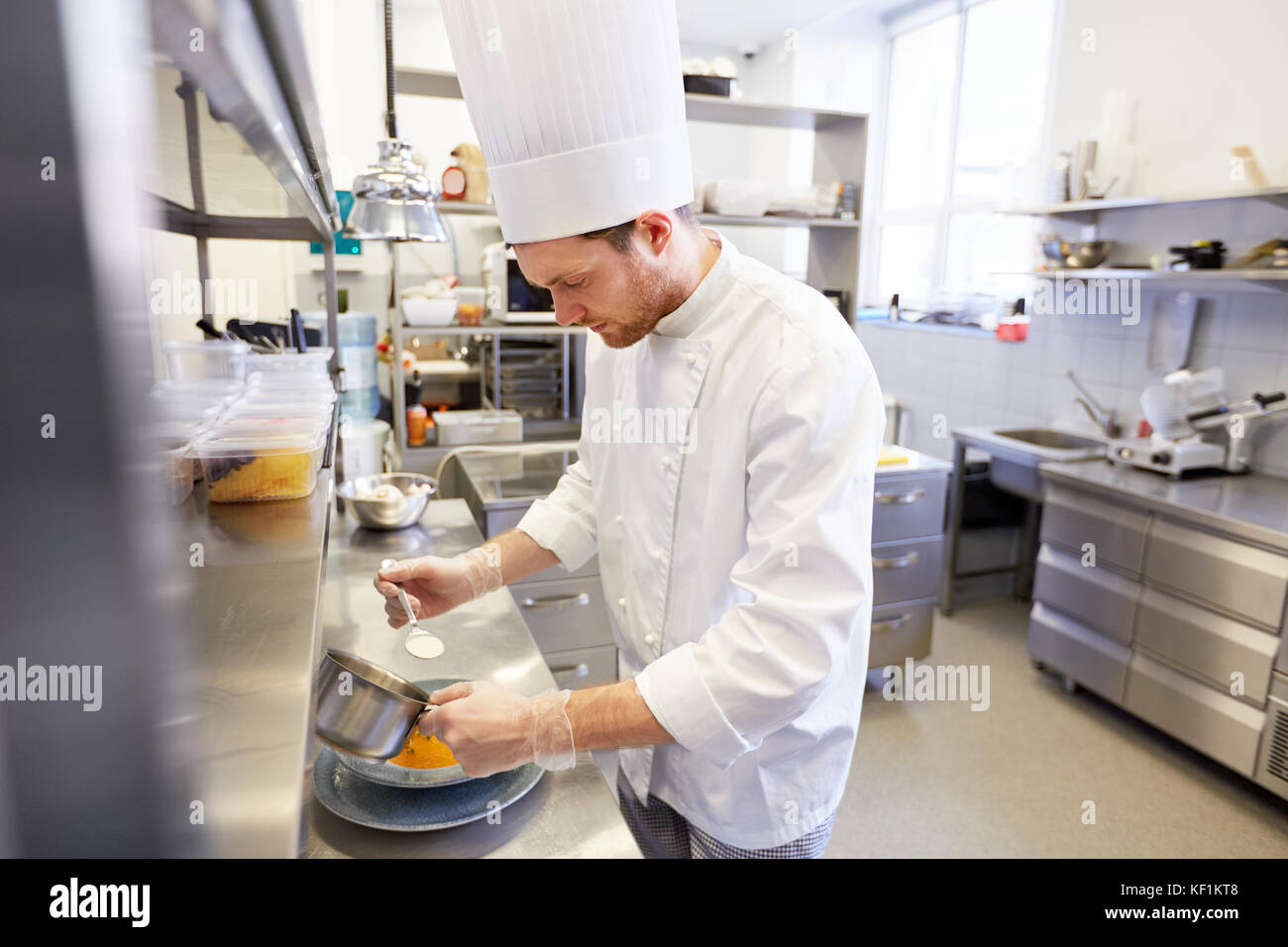 happy male chef cooking food at restaurant kitchen Stock Photo - Alamy
