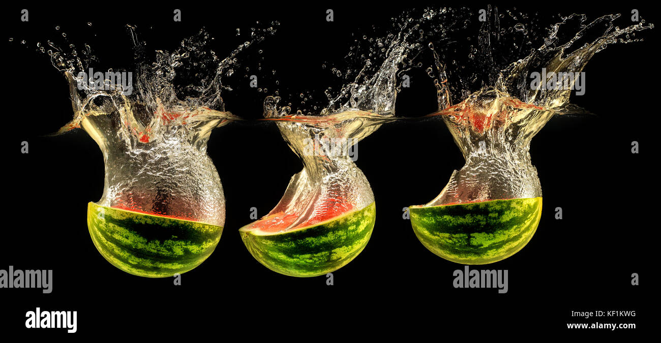 Fresh melon falling in water Stock Photo - Alamy