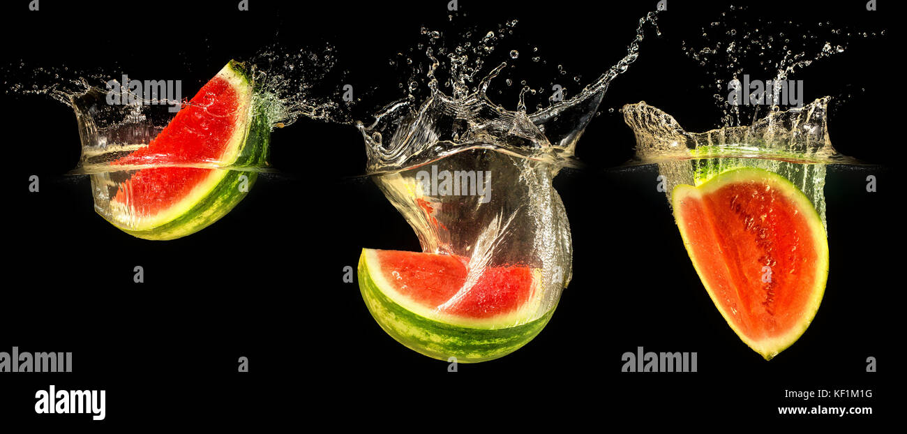 Fresh melon falling in water Stock Photo - Alamy
