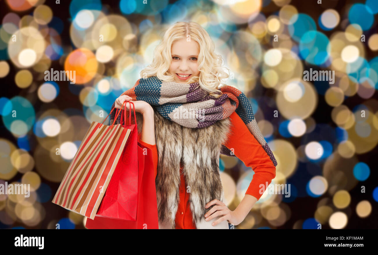 young woman in winter clothes with shopping bags Stock Photo - Alamy