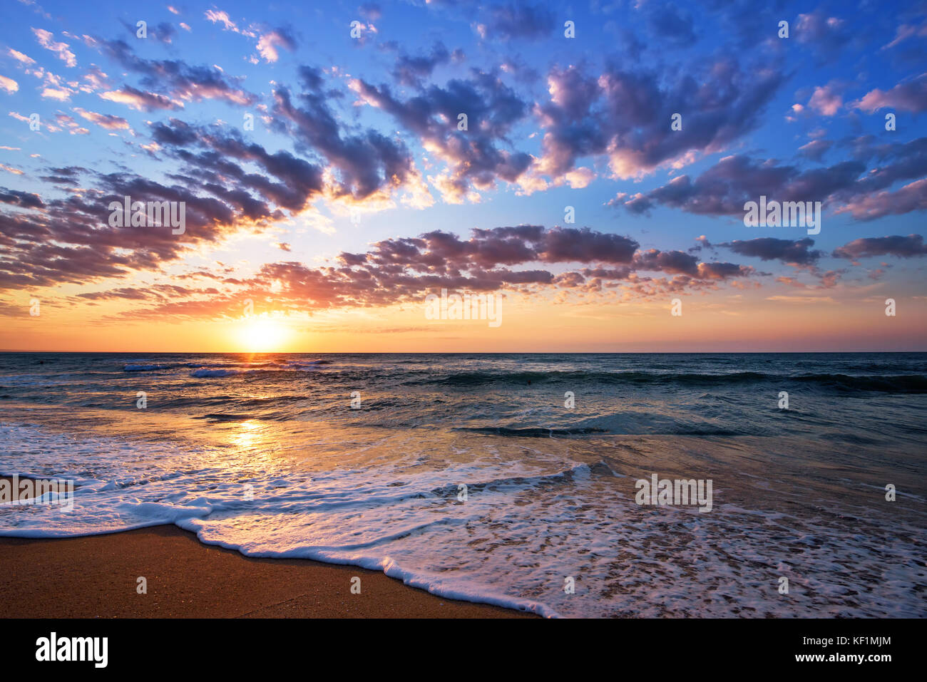 Brilliant ocean beach sunrise. Dramatic sky. Sunrise shot Stock Photo ...