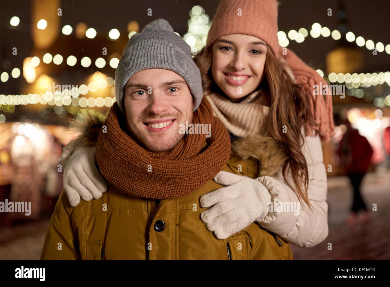 happy couple hugging at christmas tree Stock Photo - Alamy