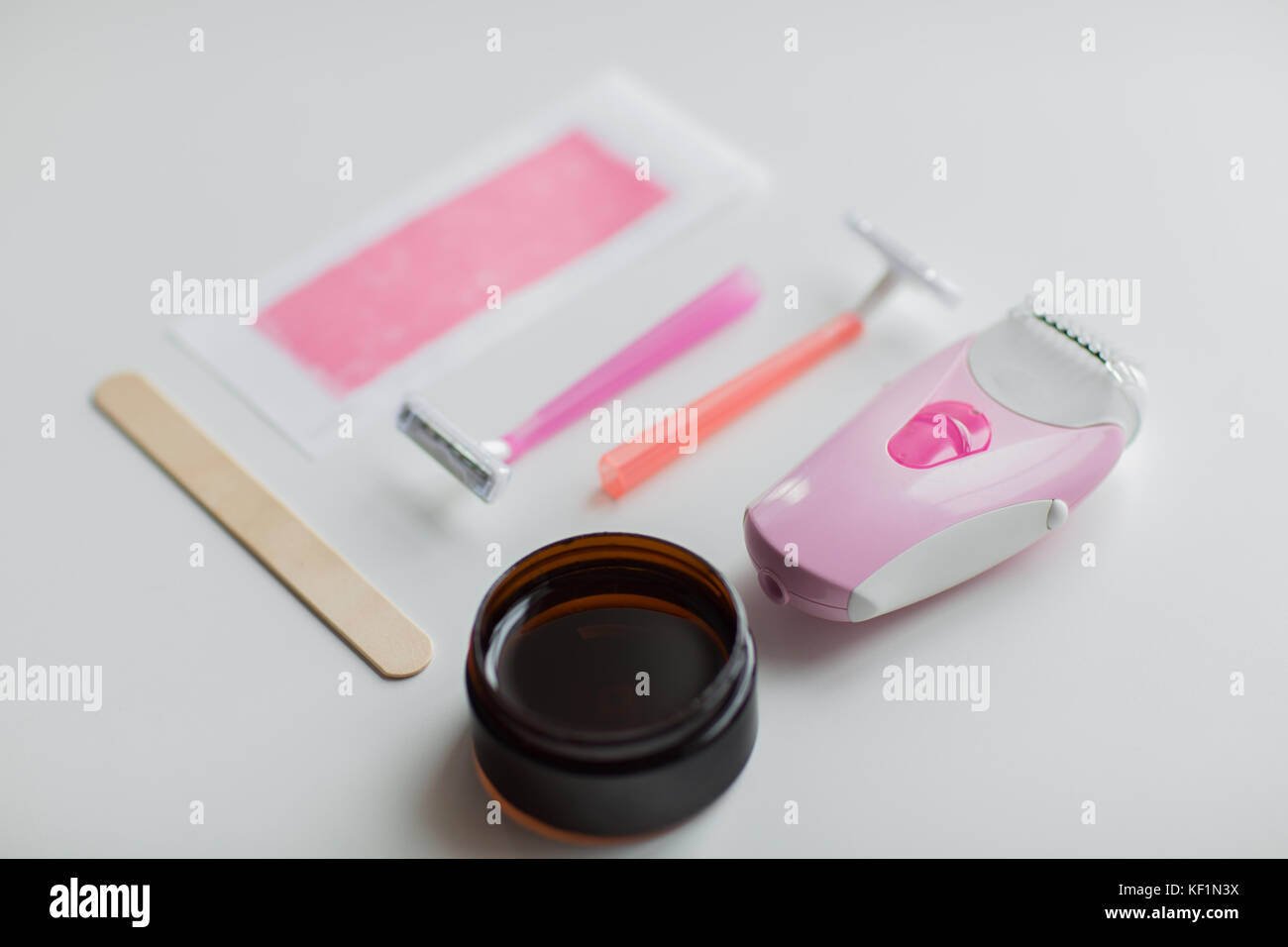 hair removal wax, epilator and safety razor Stock Photo - Alamy