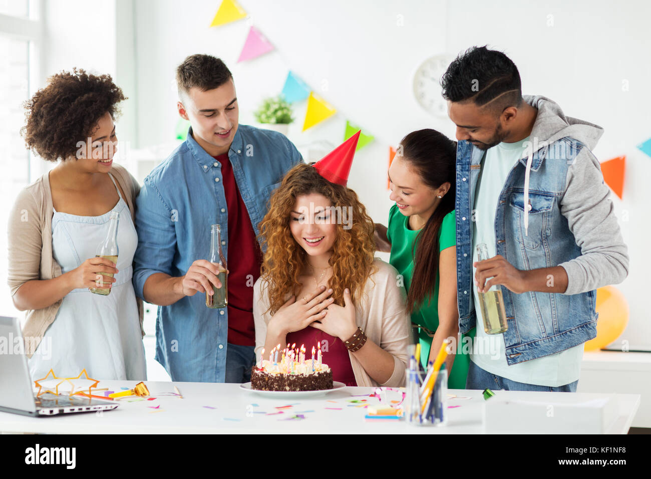team greeting colleague at office birthday party Stock Photo - Alamy