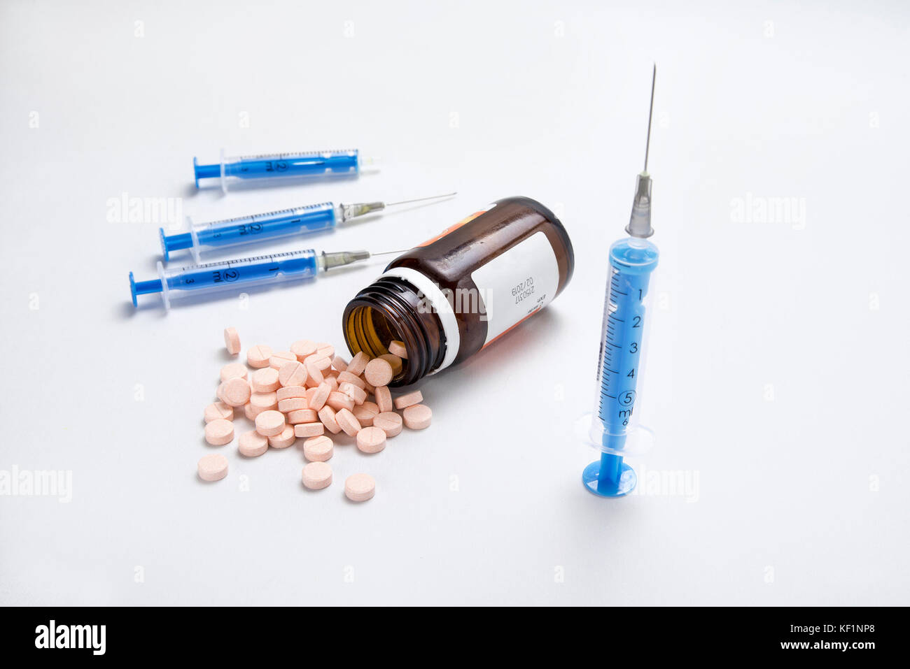 Injections with needles and pills on the whitw background Stock Photo ...