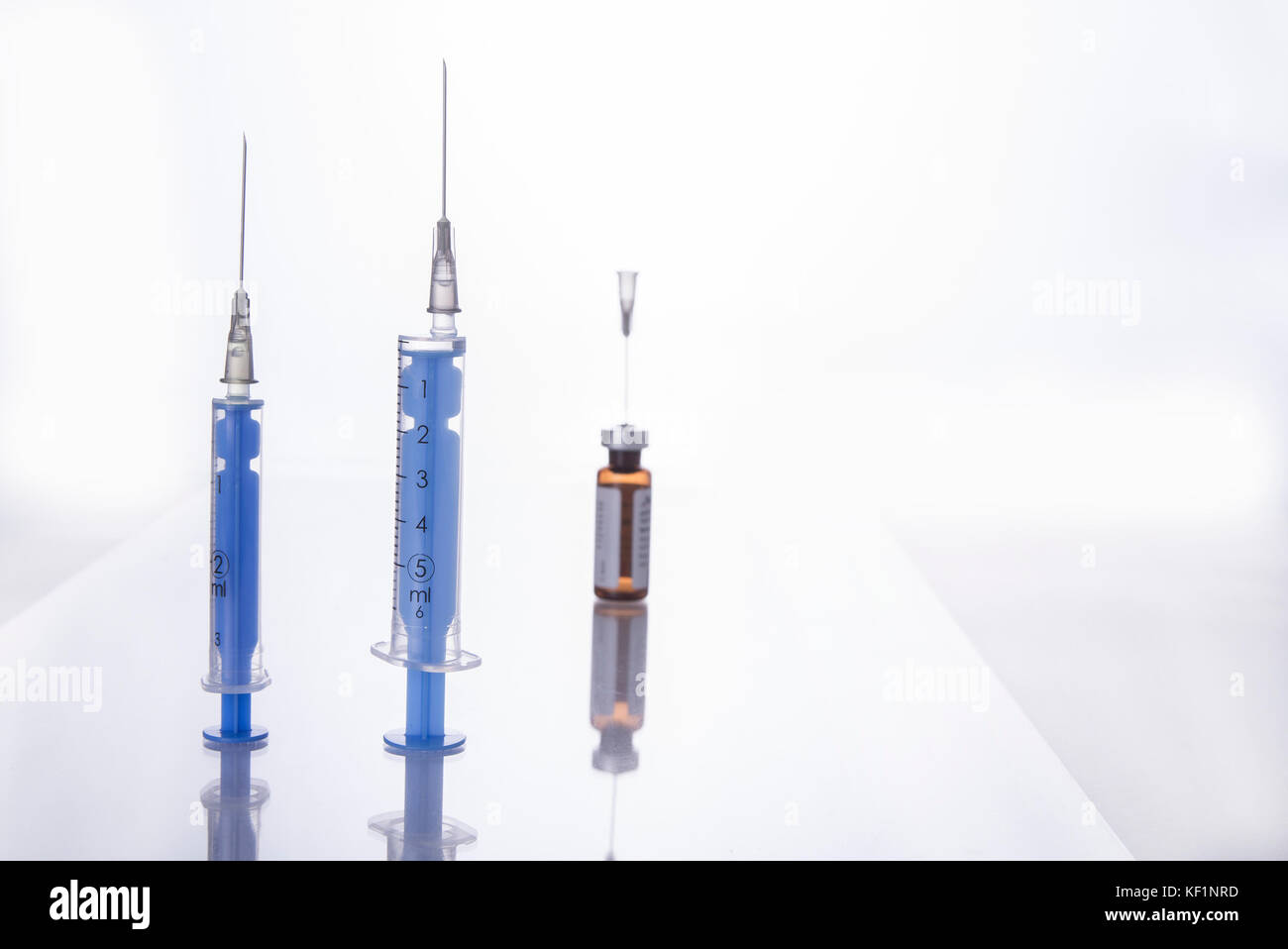 Two injections ready to fill up on the white background Stock Photo - Alamy