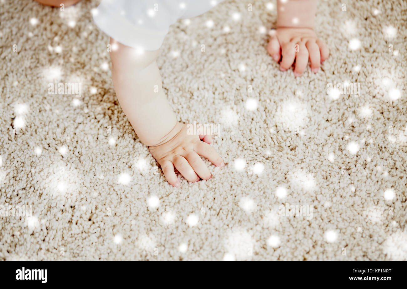 hands of baby crawling on floor or carpet Stock Photo - Alamy