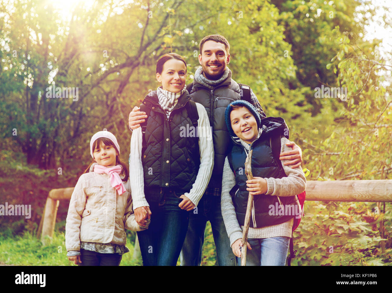 happy family with backpacks hiking Stock Photo - Alamy