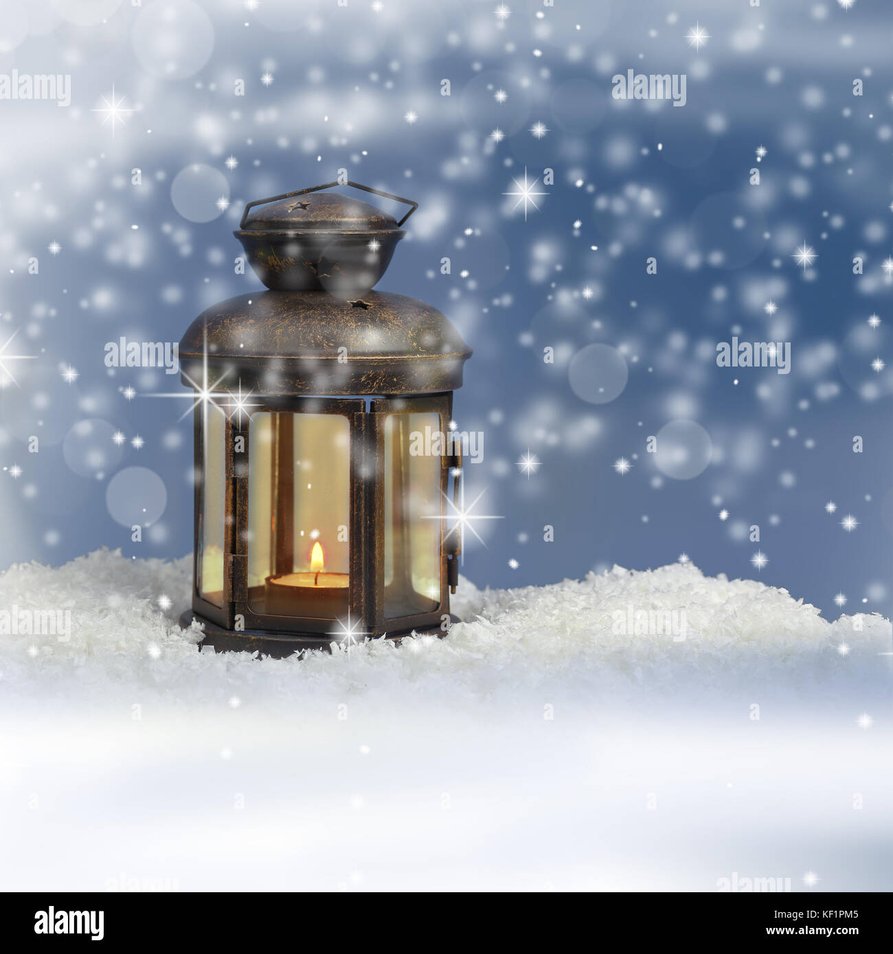 Christmas lantern on snowy background Stock Photo - Alamy