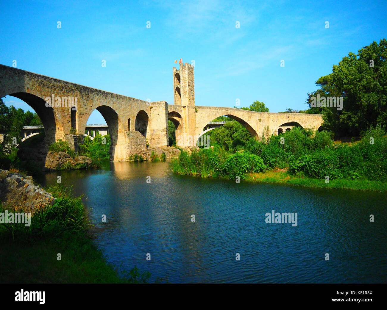 View of the Fluvia river and the medieval village of Besalu in Girona ...