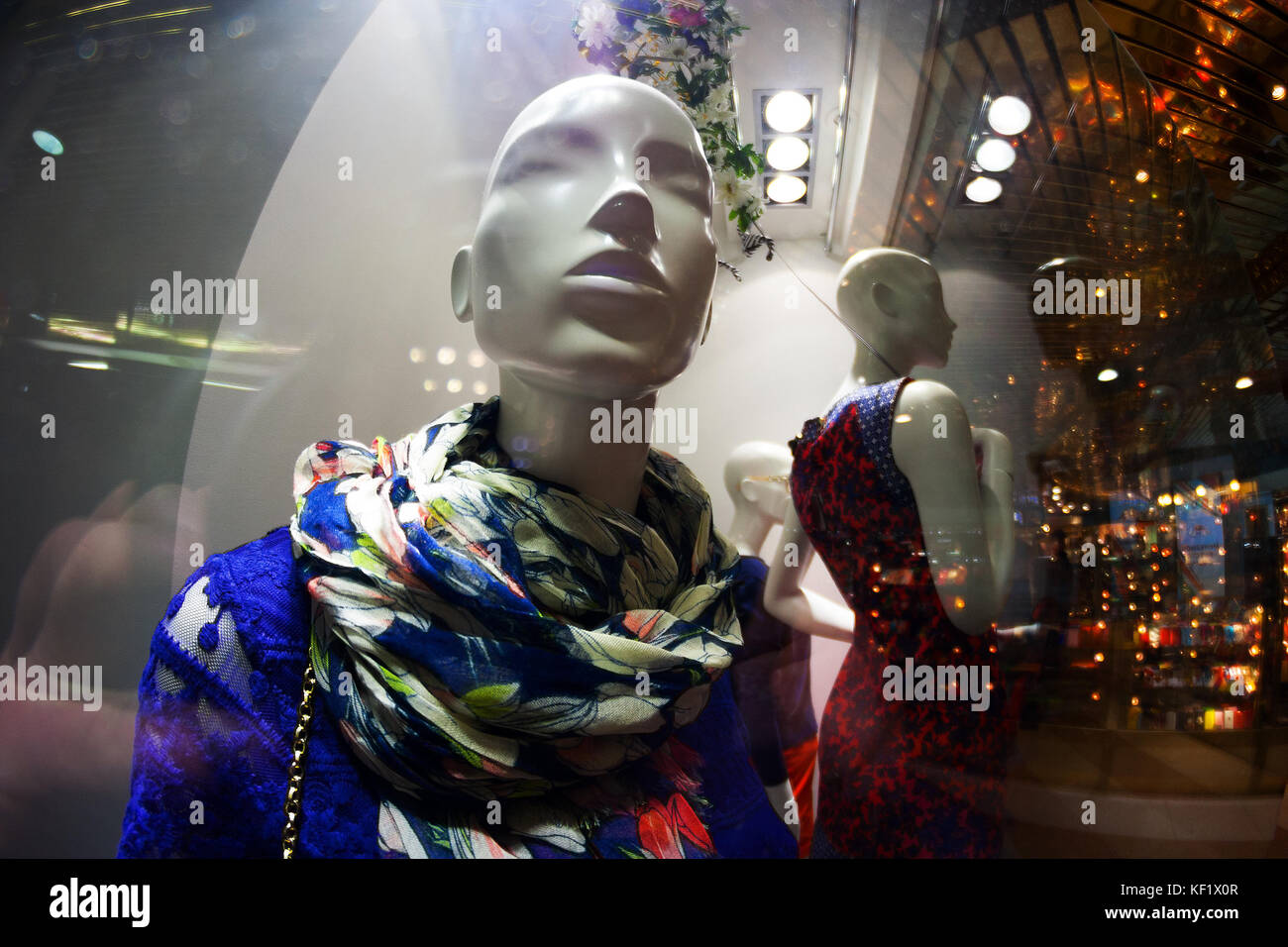 Store window with dressed women mannequins in shopping mall Stock Photo ...