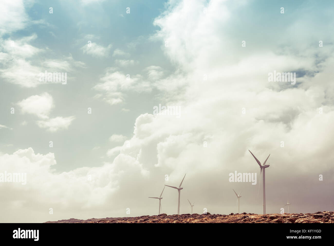 Wind turbines and stormy weather - renewable energy concept Stock Photo ...