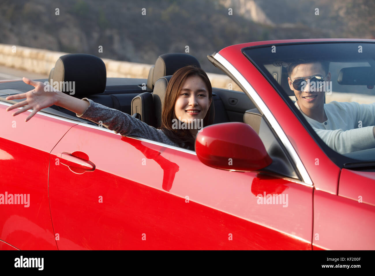 Young men and women driving out to travel Stock Photo - Alamy