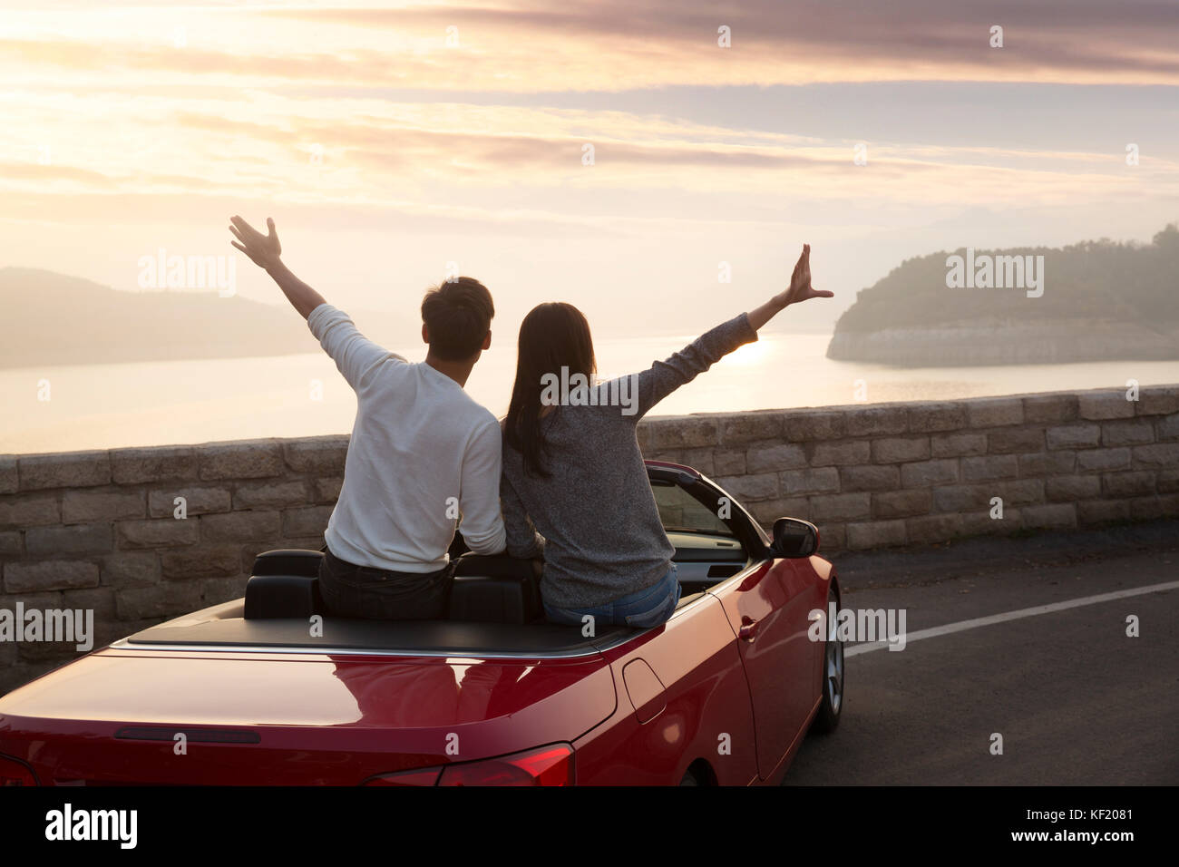 Young couple driving Stock Photo - Alamy