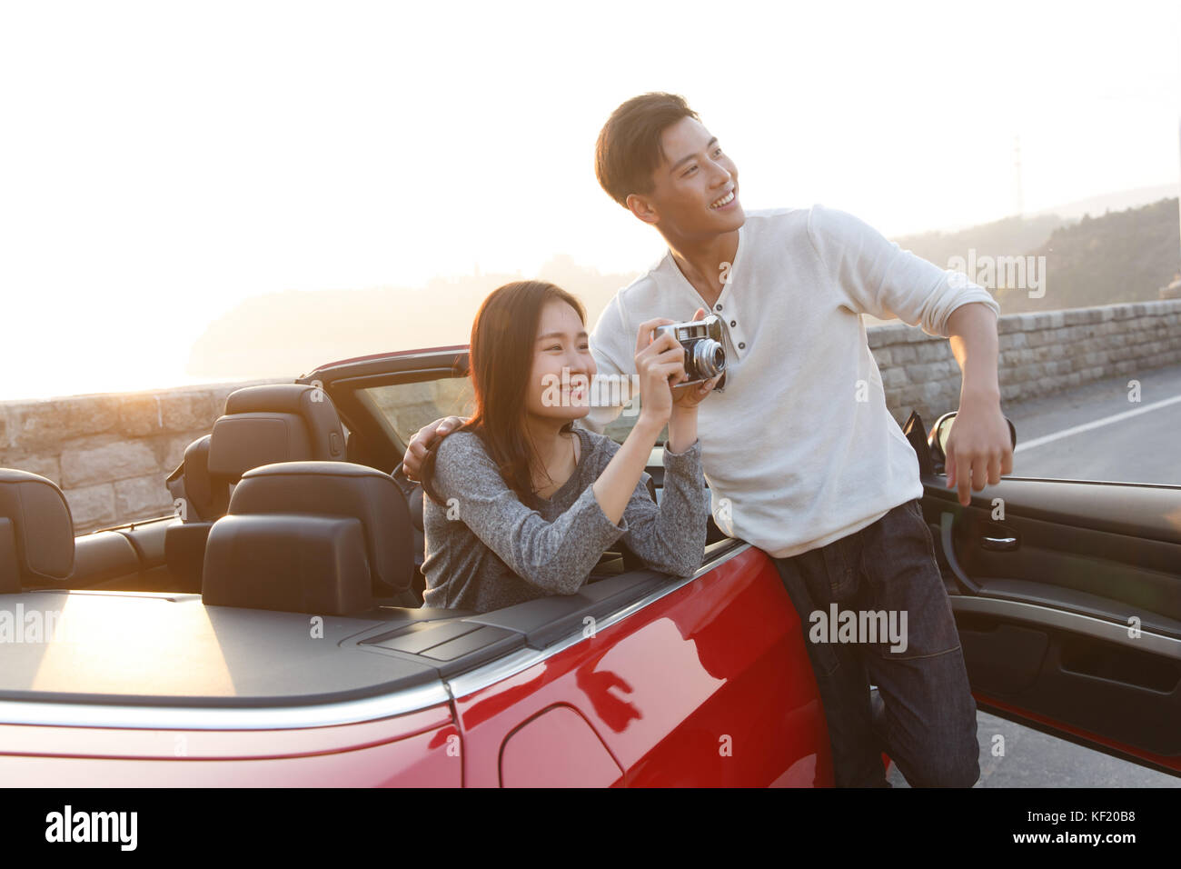 Young couple driving Stock Photo - Alamy