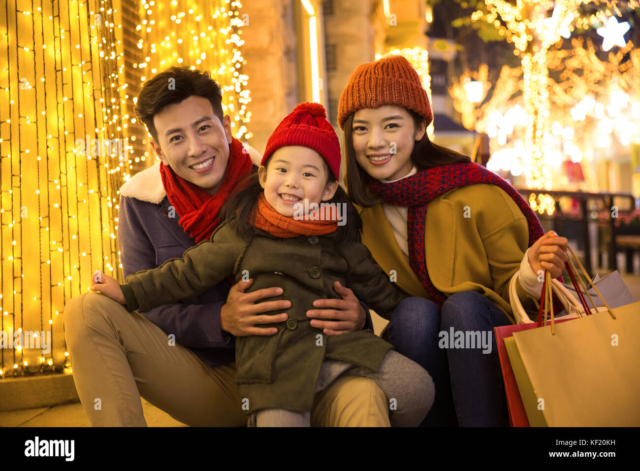 Happy family holiday shopping Stock Photo - Alamy